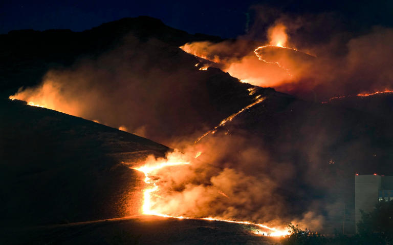 Wildfire burns in Salt Lake City foothills behind University of Utah