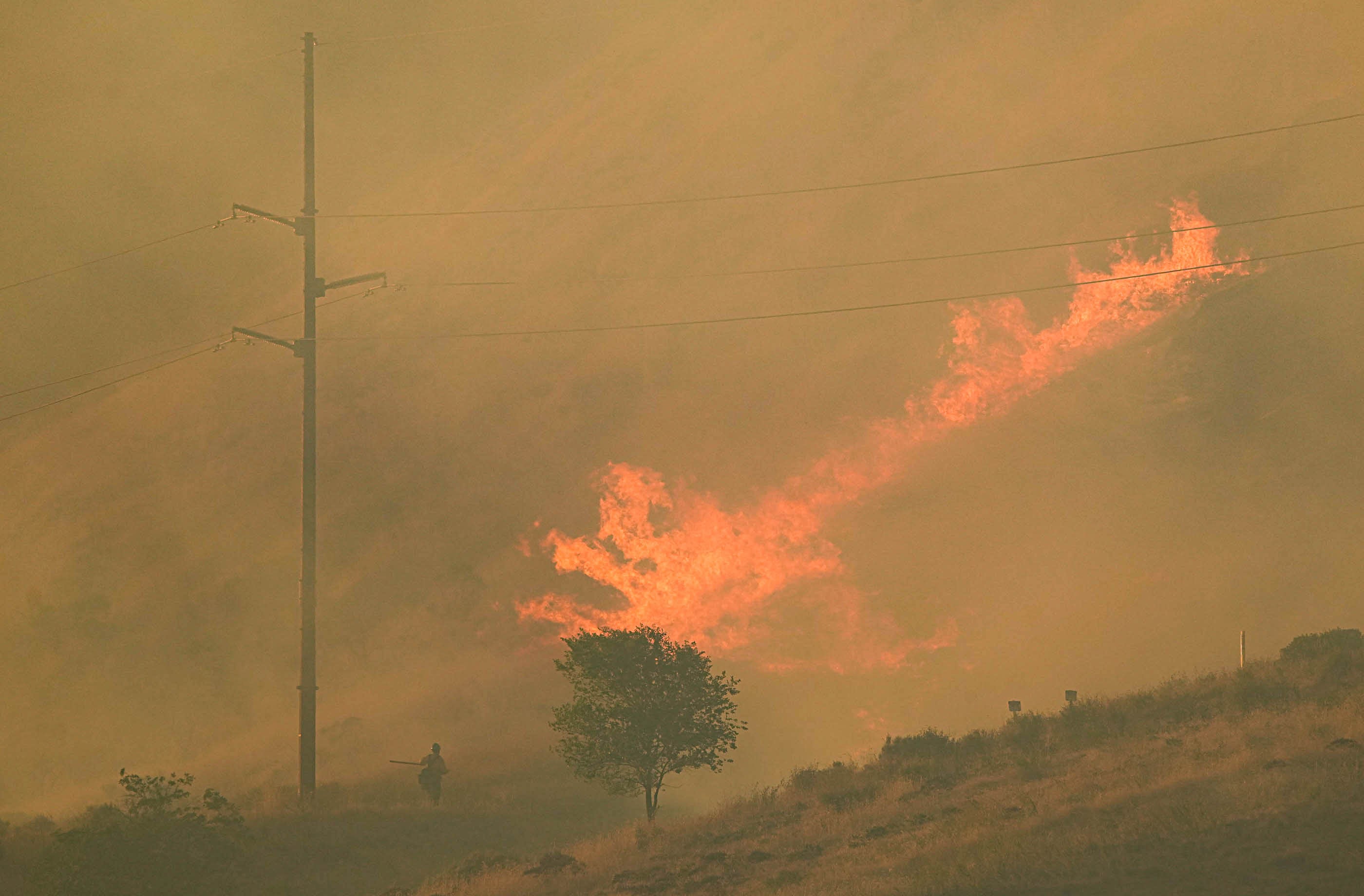 Wildfire burns in Salt Lake City foothills behind University of Utah