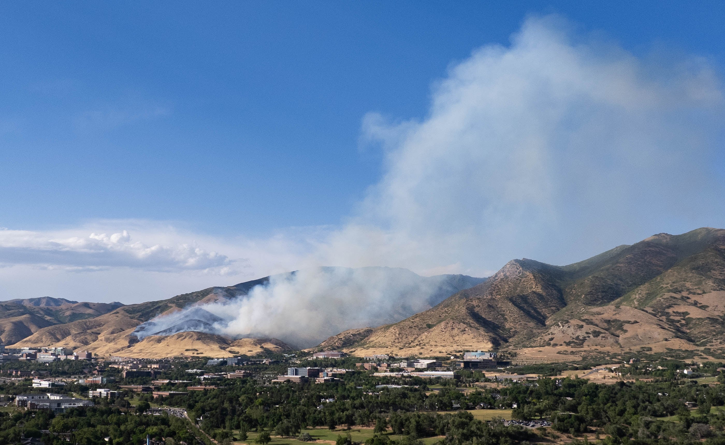 Wildfire burns in Salt Lake City foothills behind University of Utah