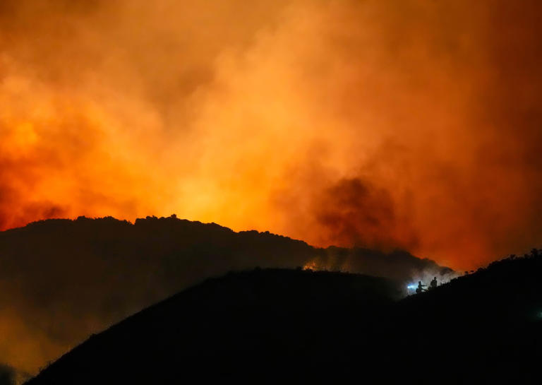 Wildfire burns in Salt Lake City foothills behind University of Utah