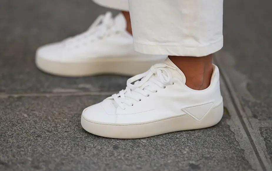 White sneakers cement status as 2026's airport fashion essential
