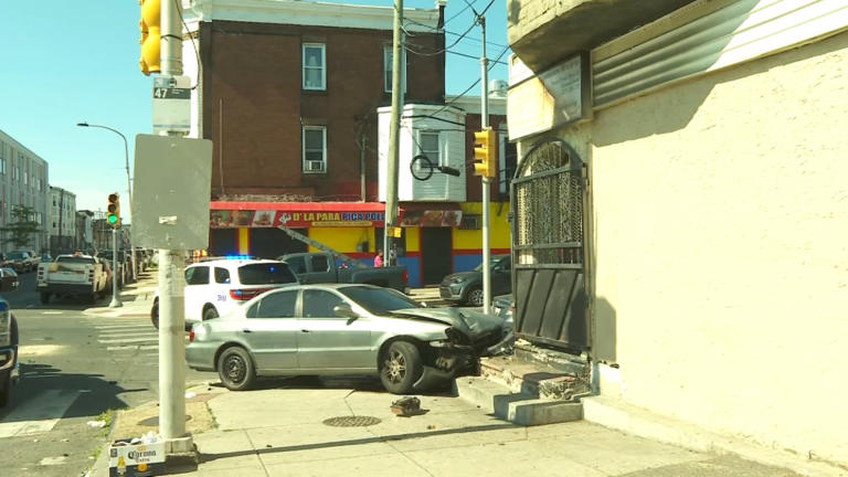 Car slams into steps of Philadelphia building after two-vehicle crash