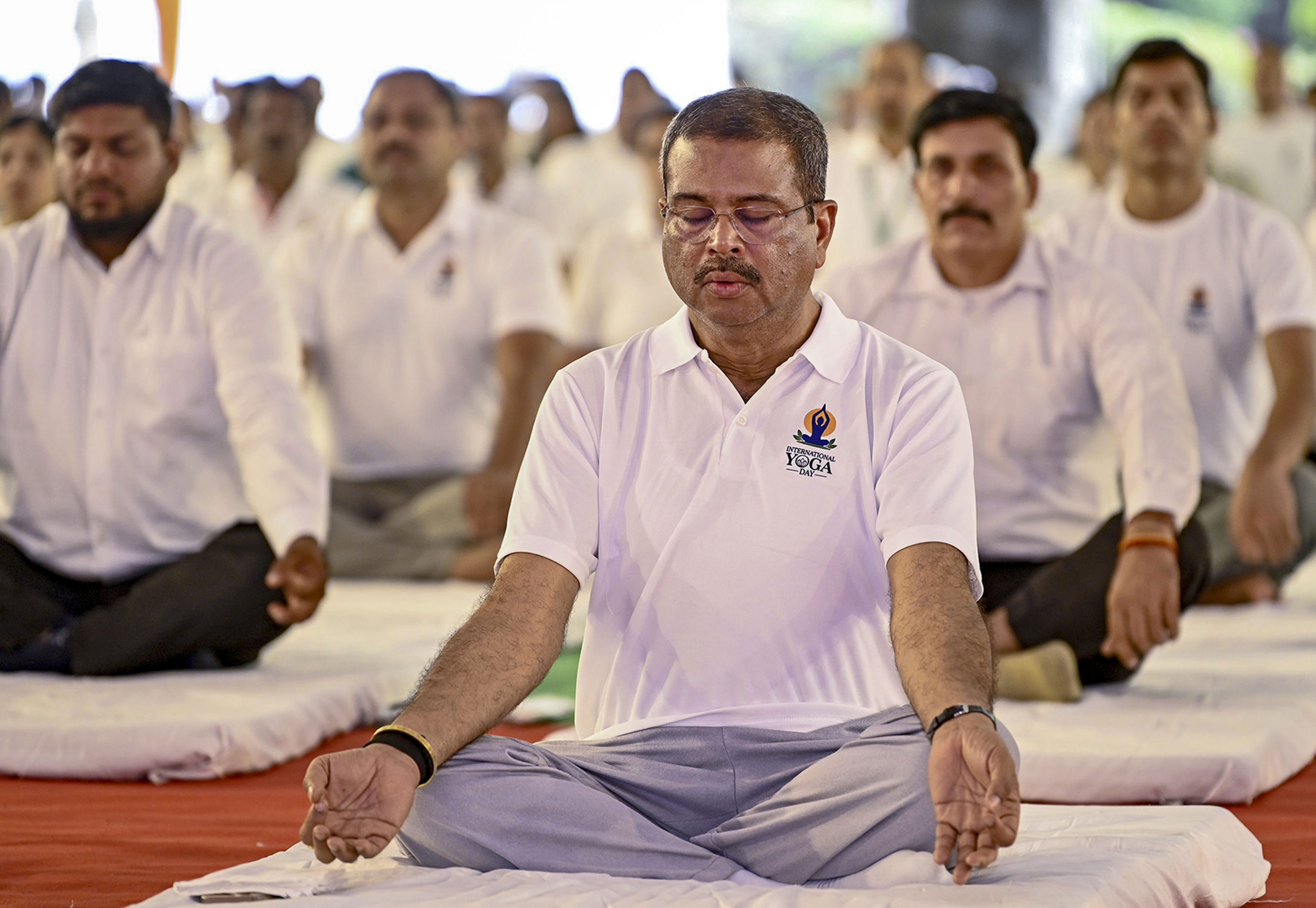 Yoga offers solutions to global health challenges: Pradhan at DU event