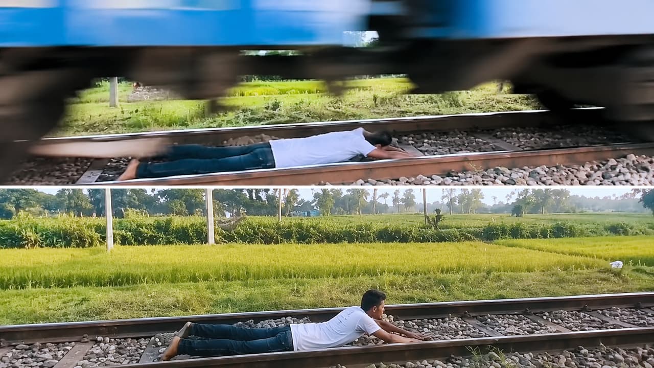 Watch: Man lies on railway track while train passes for reel, video ...