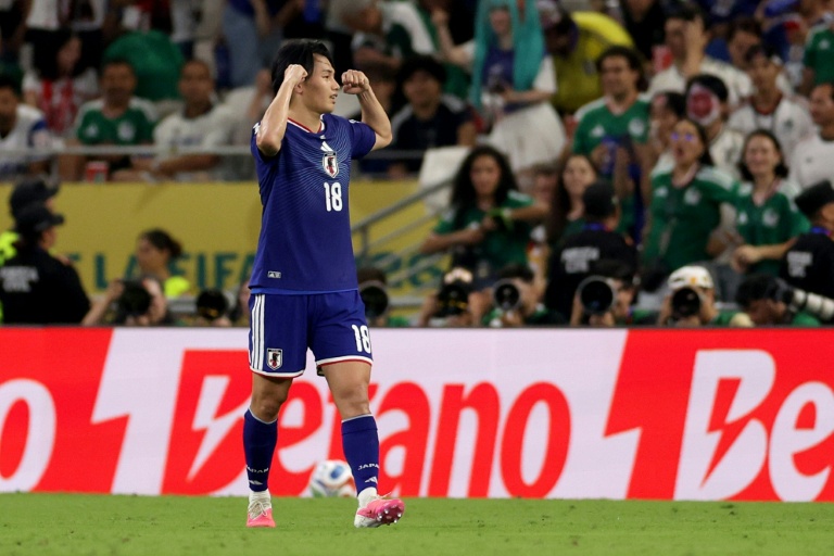 Japan stroll to victory over Tunisia in World Cup's 1,000th game