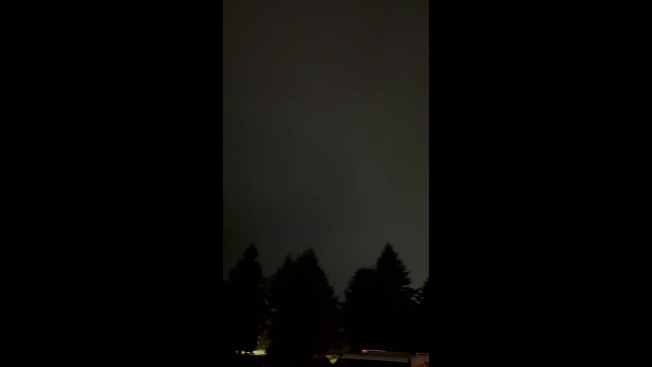 Lightning illuminates sky during nighttime thunderstorm in Ohio, USA