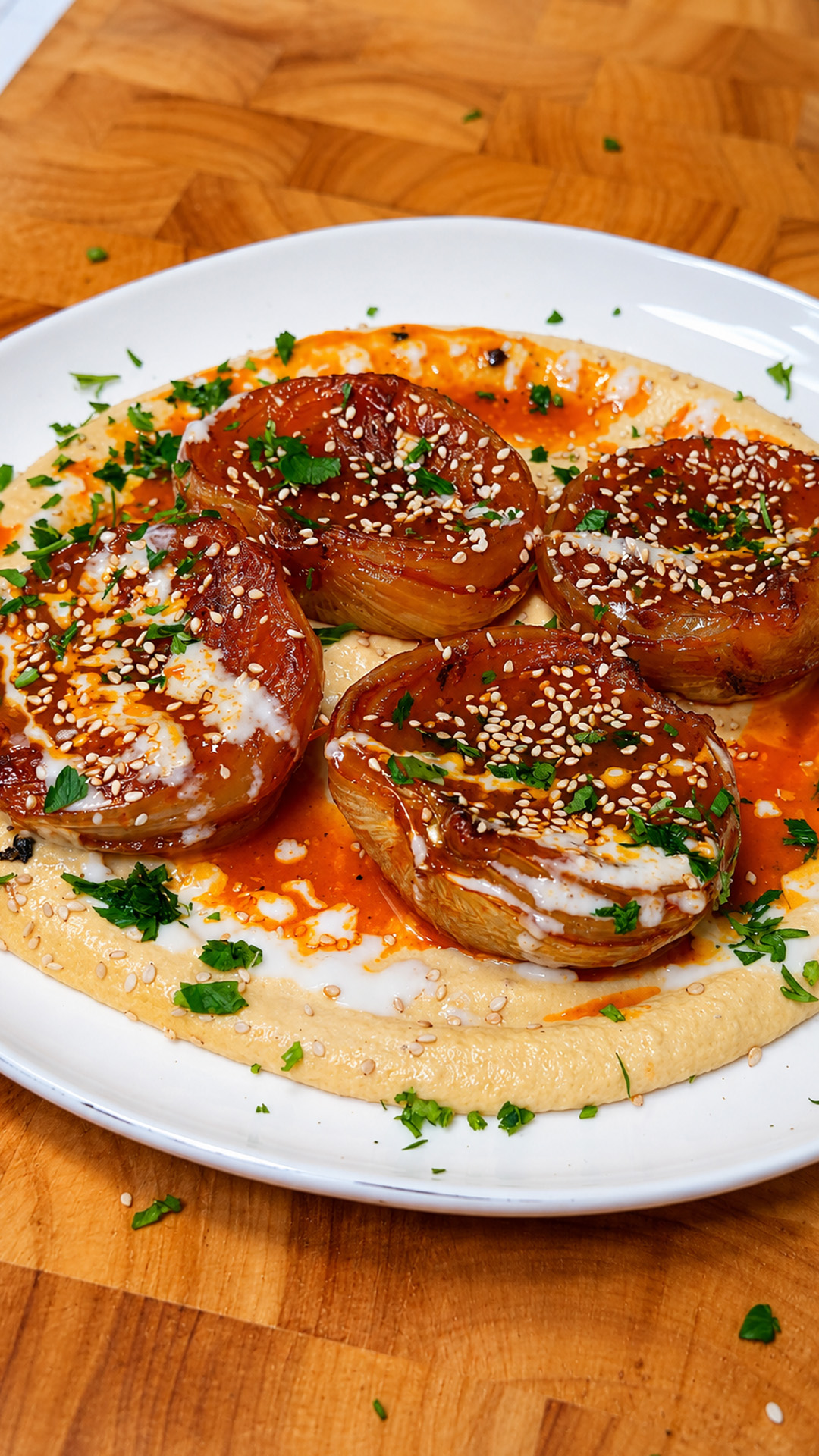 Marinated roasted onions served with creamy roasted garlic hummus