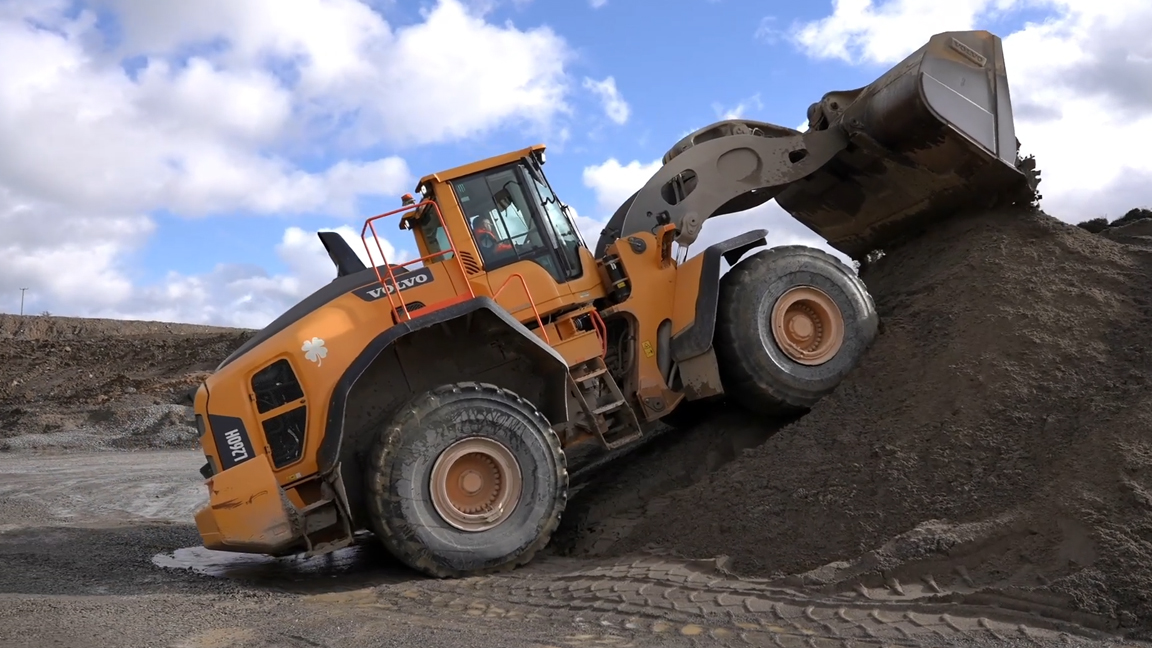 Giant loader tackling challenging terrain and massive loads