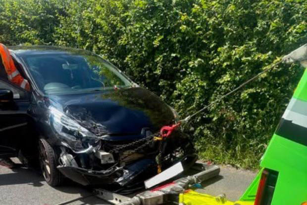 Cars badly damaged after crash on main road