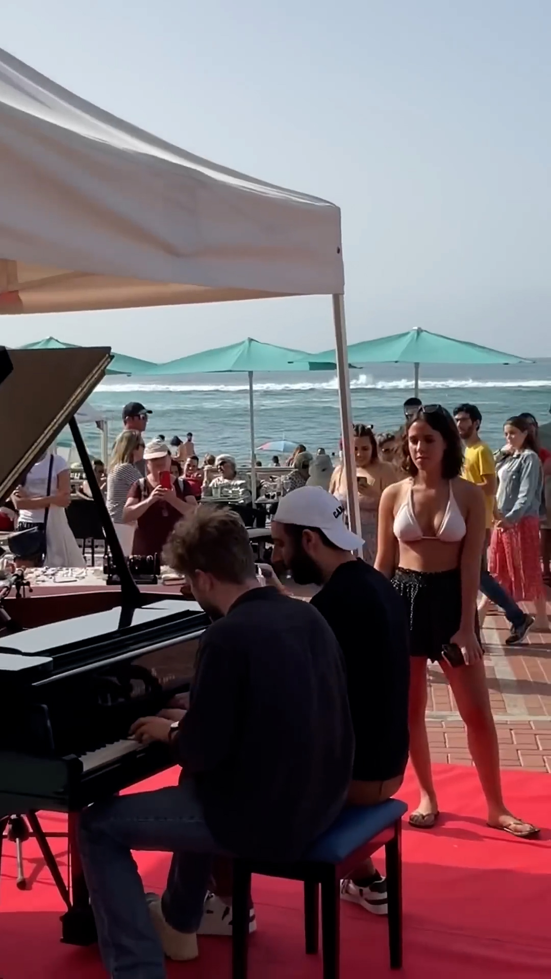 Playing piano together at the beach