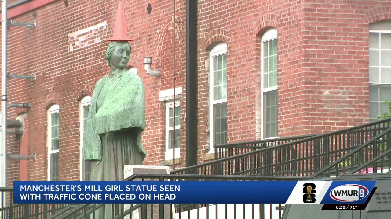 Scottish influence? Mill Girl statue in Manchester seen with traffic ...