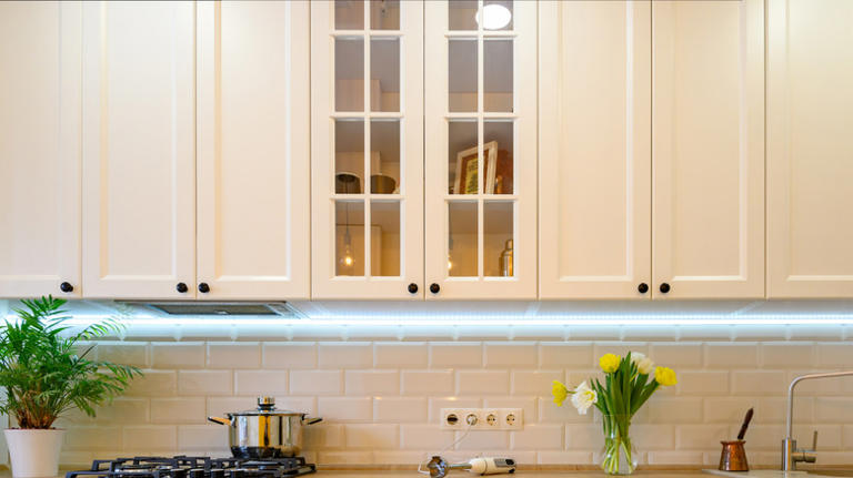 Not bright white: The paint color that gives dated honey oak cabinets a ...