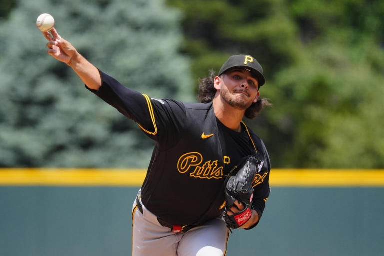 Pirates build big lead, survive late Rockies rally