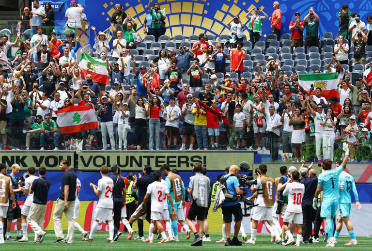 Soccer-Iran draw strength from adversity after holding Belgium to draw