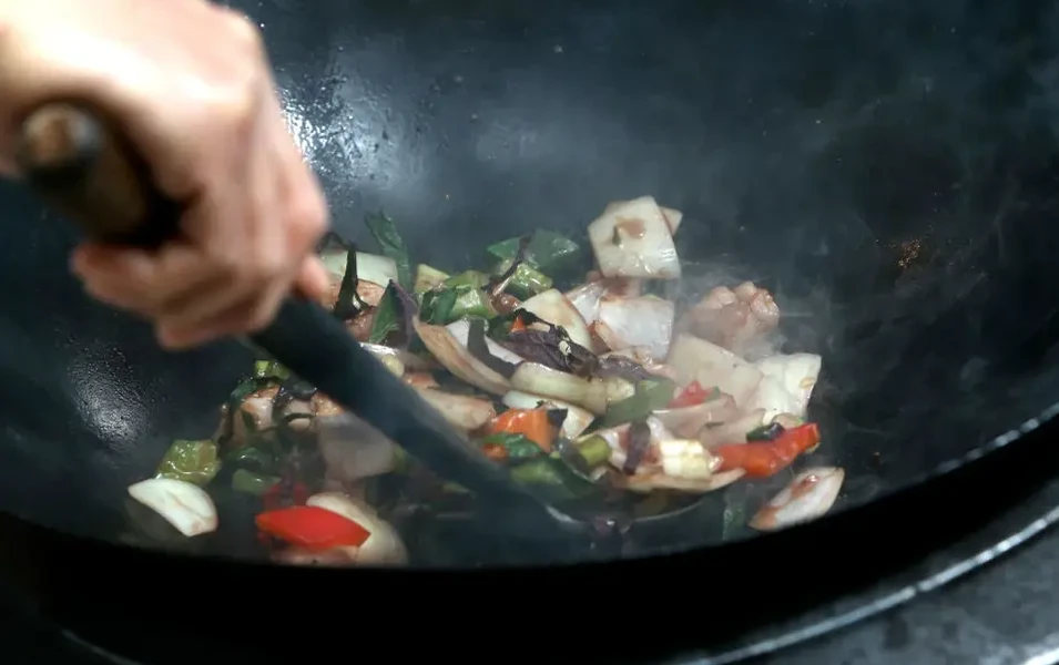 Mastering wok cooking at home