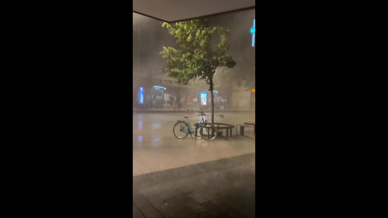 Strong winds and heavy rain batter street in Mannheim, Germany