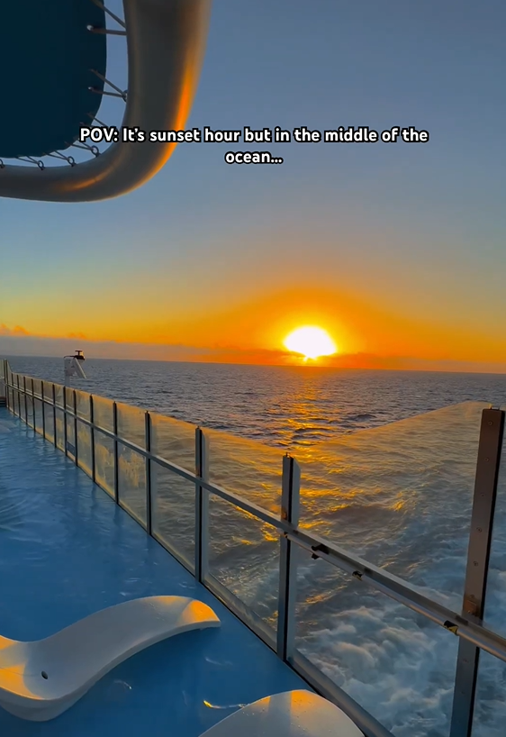 Cruise ship sunset views at sea with golden horizon reflections