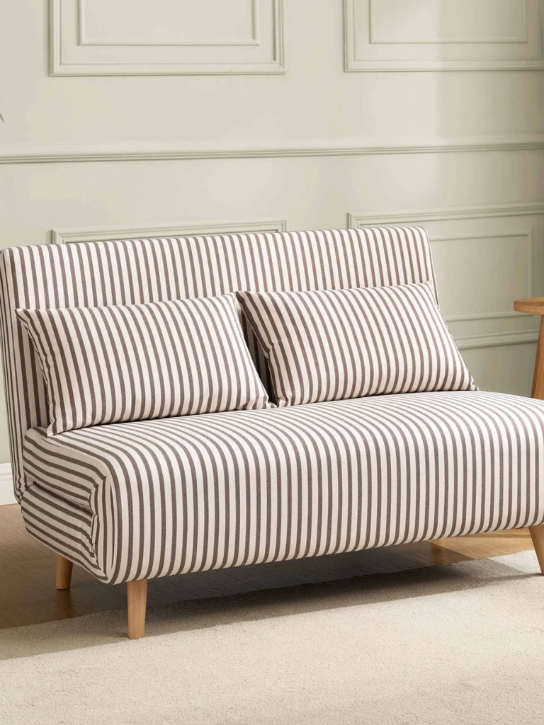 This compact futon-style sofa bed looks better in sleep mode