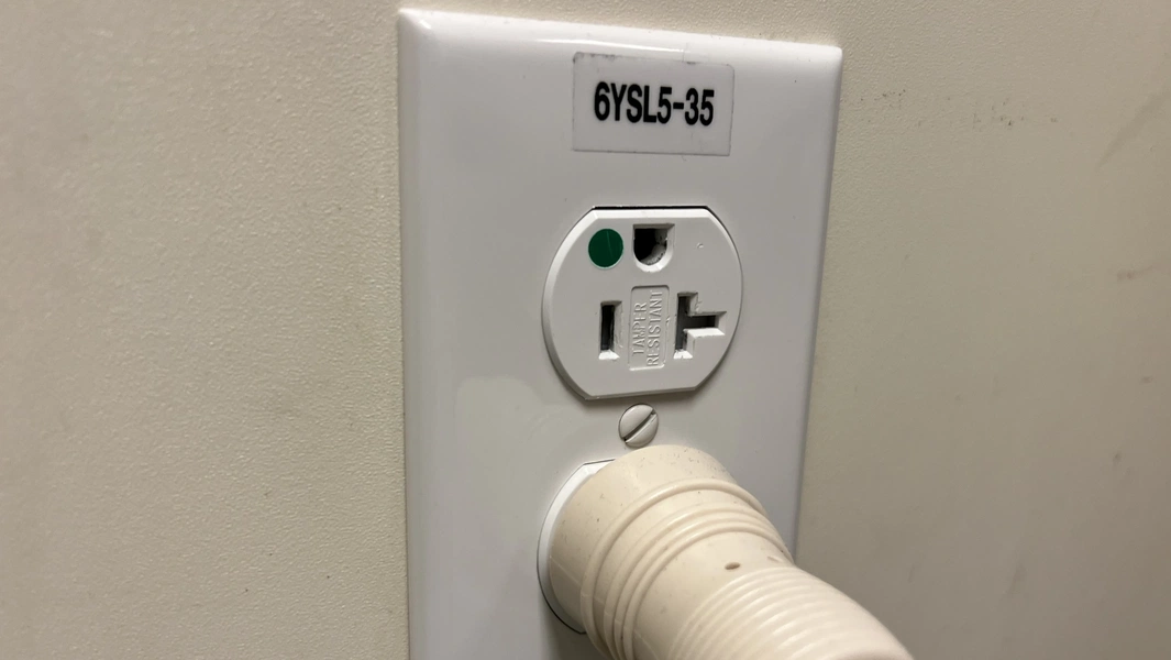 Why electrical outlet orientation varies