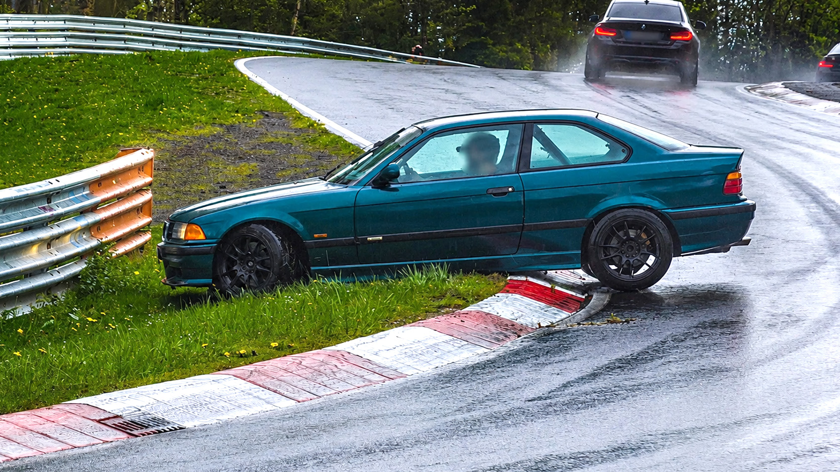 BMW nearly crashes into the wall after losing control