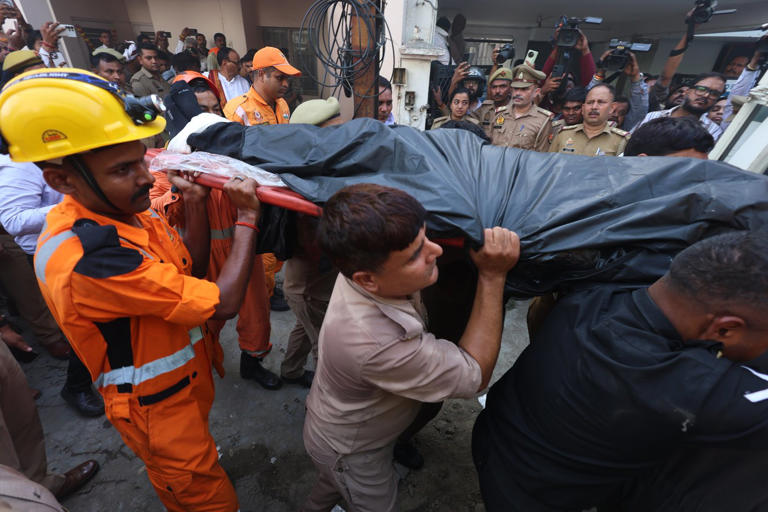 Fire tears through building in northern India, killing 14, mostly students