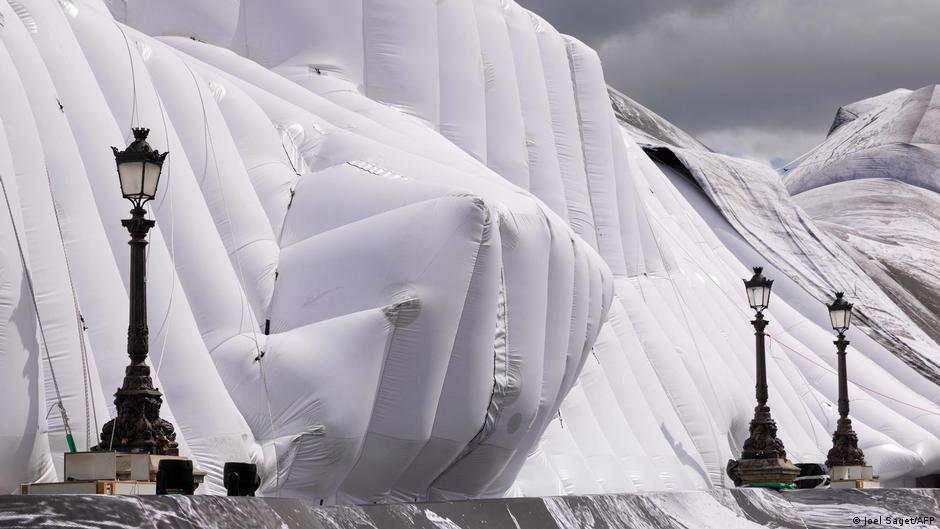 Christo-like art project turns Parisian bridge into cave