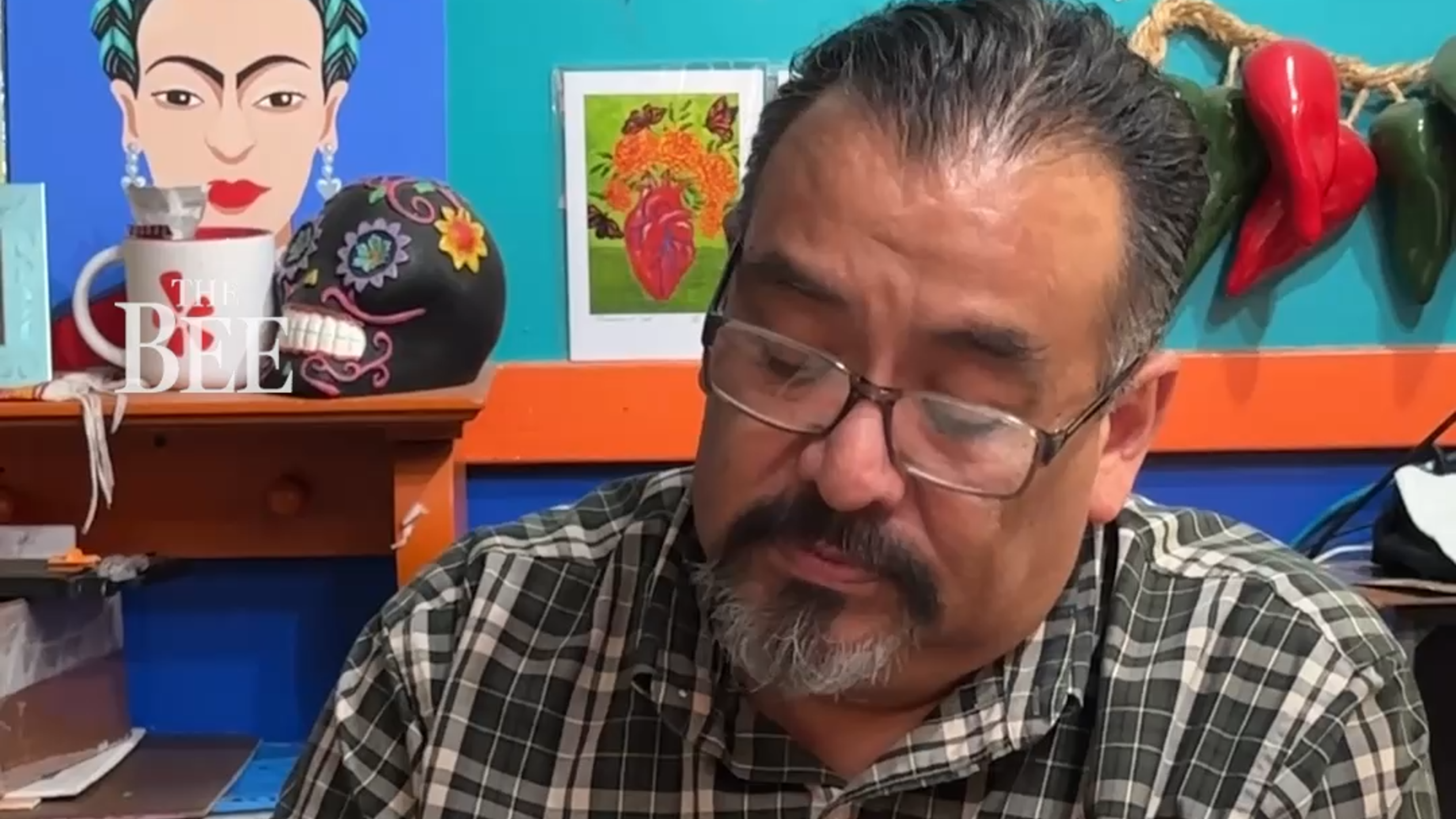 See Sacramento artist create hand-painted earrings inspired by Frida Kahlo