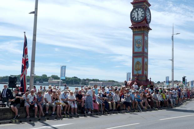 Pictures crowds turn out for 'moving' military parade in the sunshine
