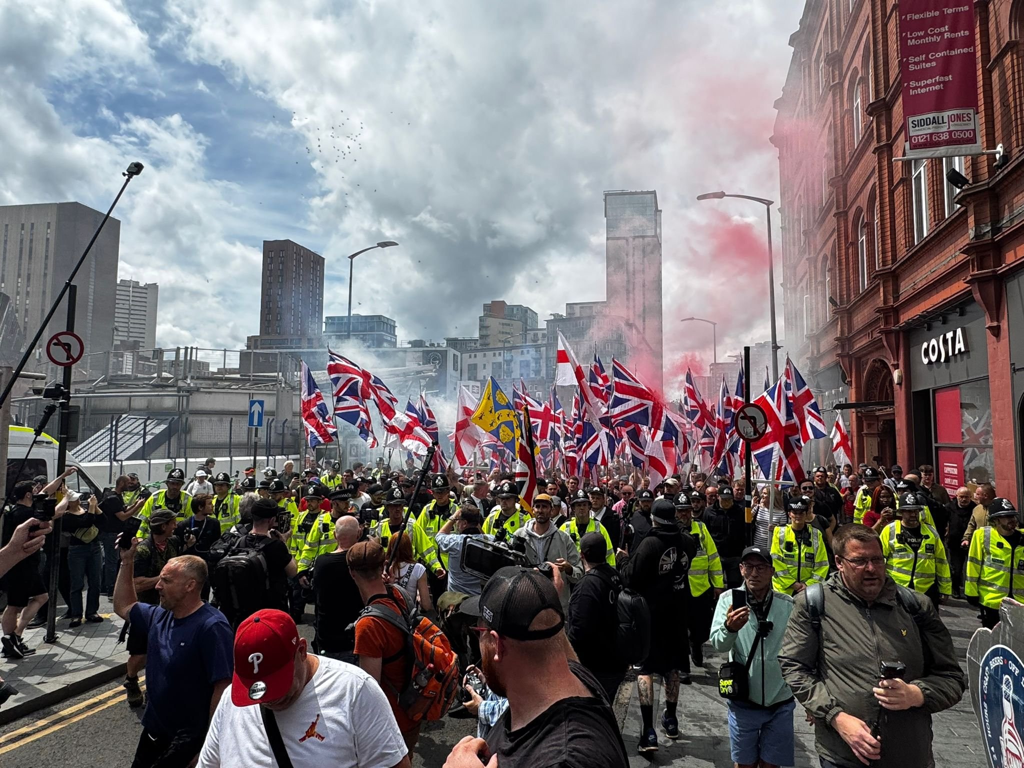 Britain First protesters set off flares in Birmingham march