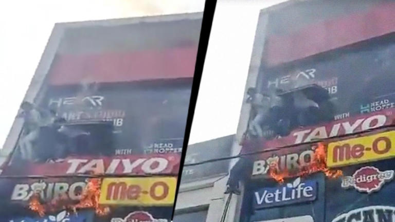 Video: Rescue teams use ropes to save people trapped in fire-hit ...