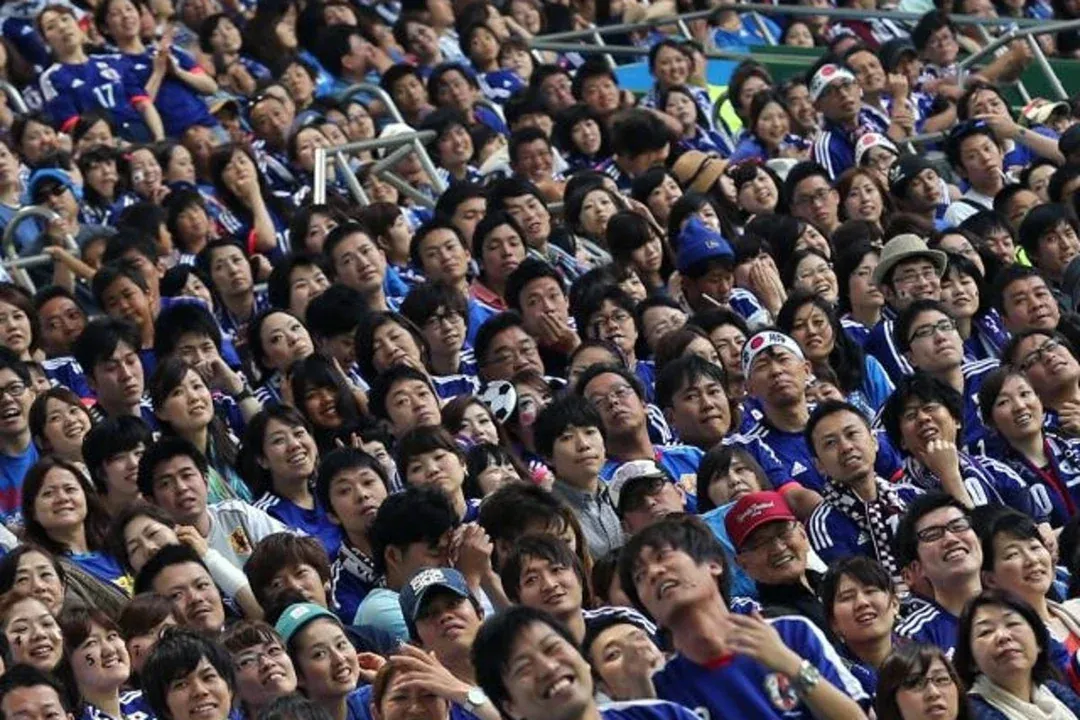 Why do Japanese players and fans clean up after World Cup matches?