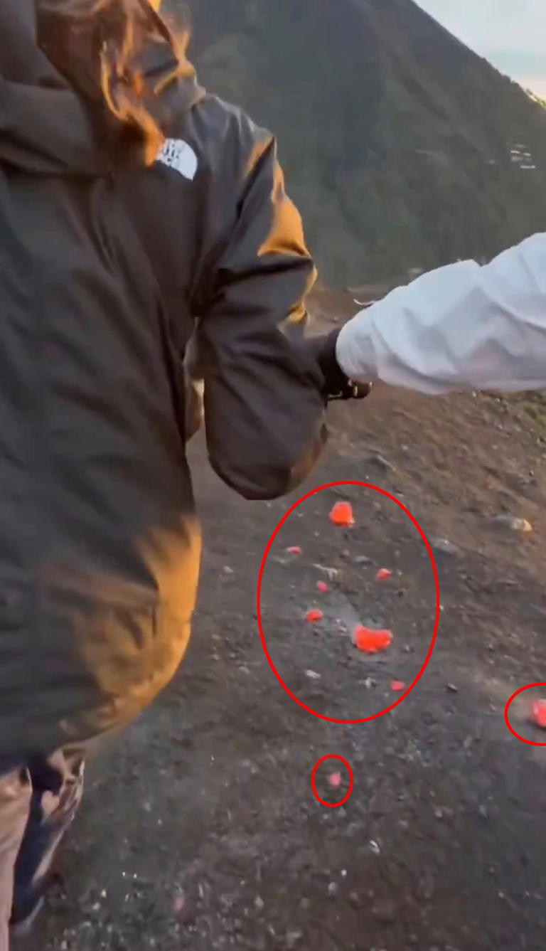 Terrified tourists scramble for cover as they’re pelted with lava ...