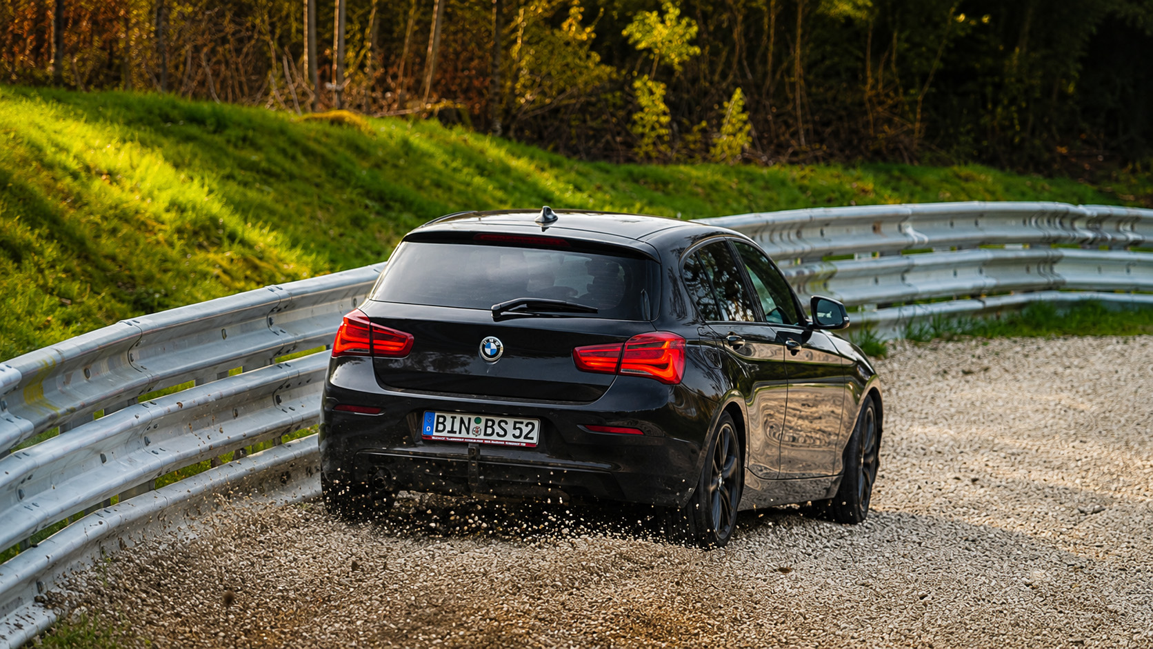 BMW loses control and flies into the gravel trap, barely missing the ...