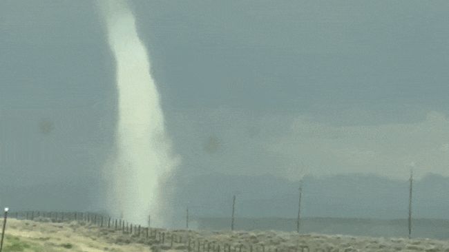 Towering landspout whips up dust in western Wyoming