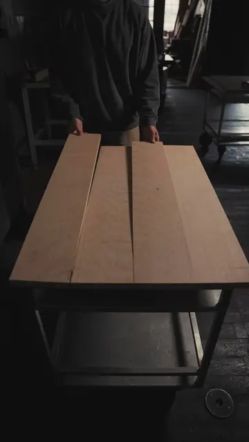 Gluing up a solid beech workbench top with parallel clamps