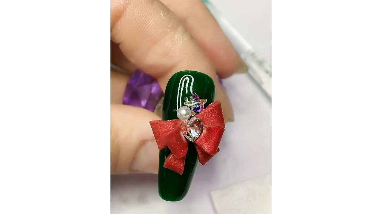 Designing Festive Holiday Nails With Sparkling Red Ribbon And Star Gem ...