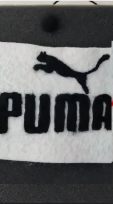 Puma logo reimagined with intricate wool crafting
