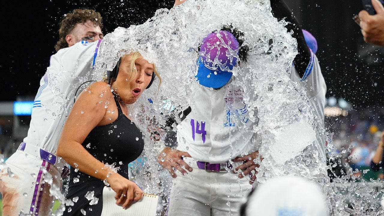 MLB sideline reporter gets drenched in wild post-game celebration ...