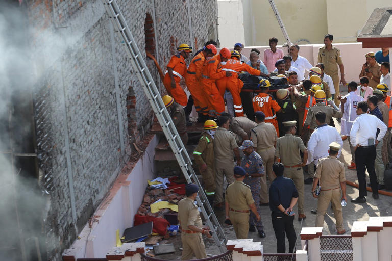 Fire tears through building in northern India, killing 14, mostly students
