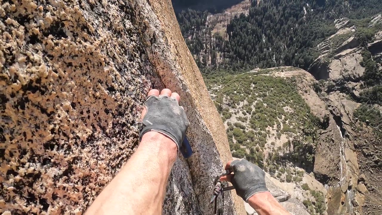 One slip on this 2,000-foot rock pillar could be fatal, "Don't look down"