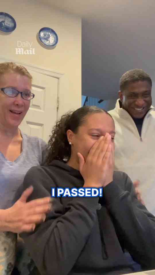 Parents celebrate daughter's nursing exam success