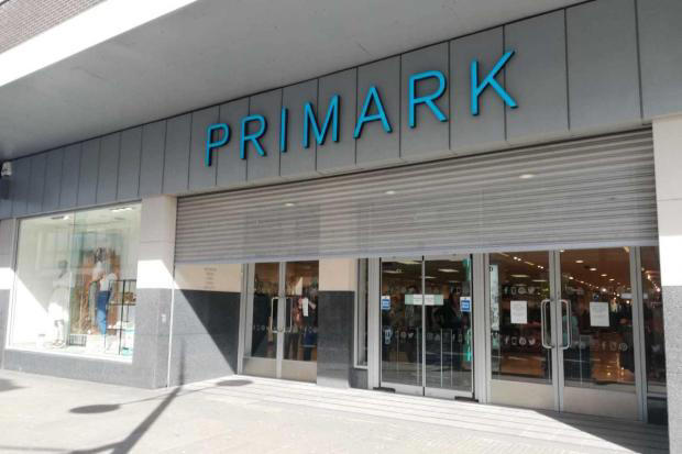 Man arrested after reports of 'inappropriate photos' taken in shop