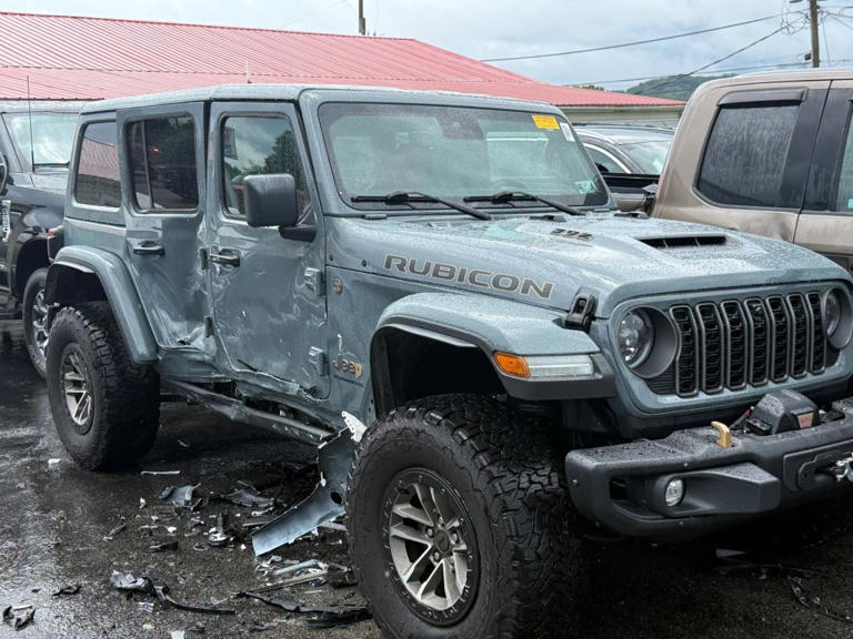 Person injured after car crashes into St. Albans used car lot