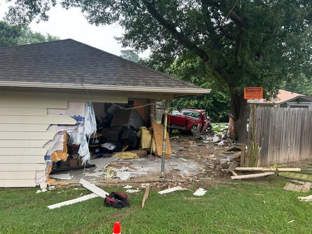 1 injured after truck drives through Longview home
