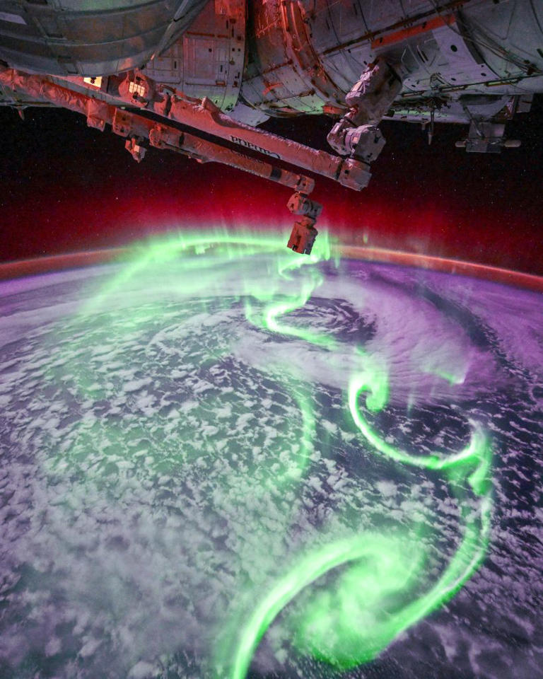 Space station crew left awestruck by aurora glowing above Earth