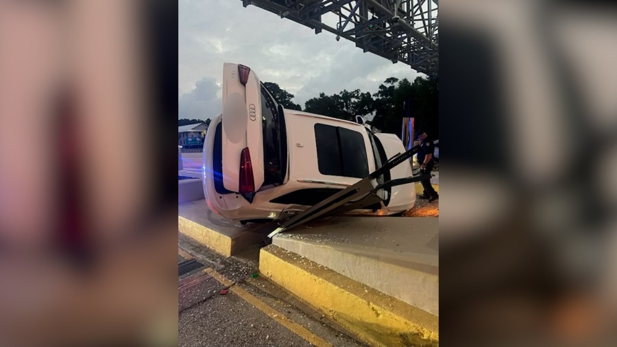 ‘Driver didn’t even try to pick a lane’: Car flips at Causeway toll booth