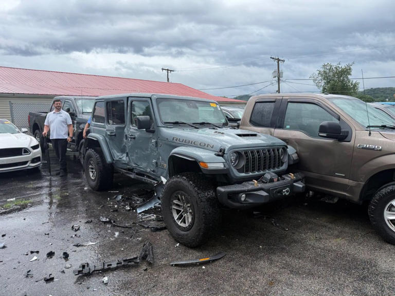 Person injured after car crashes into St. Albans used car lot