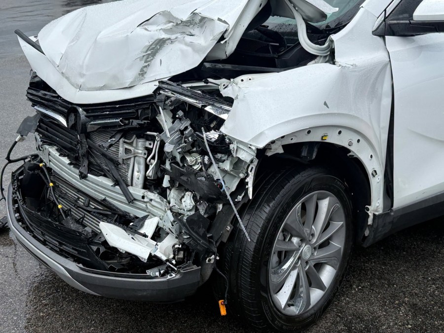 Person injured after car crashes into St. Albans used car lot