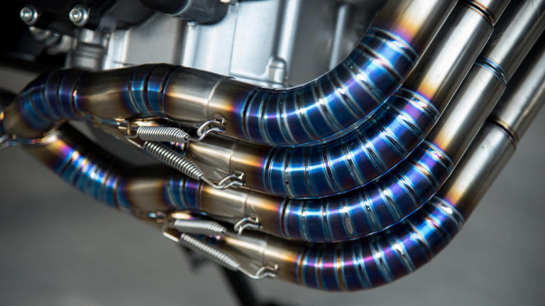 Why do some motorcycle exhaust pipes turn blue?