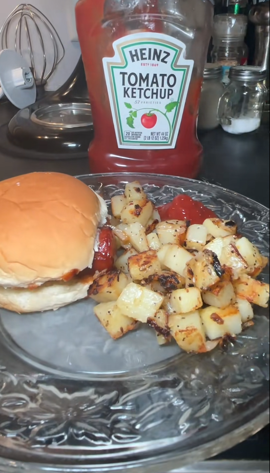 Retro style BBQ smoked sausage sandwich and fried potatoes